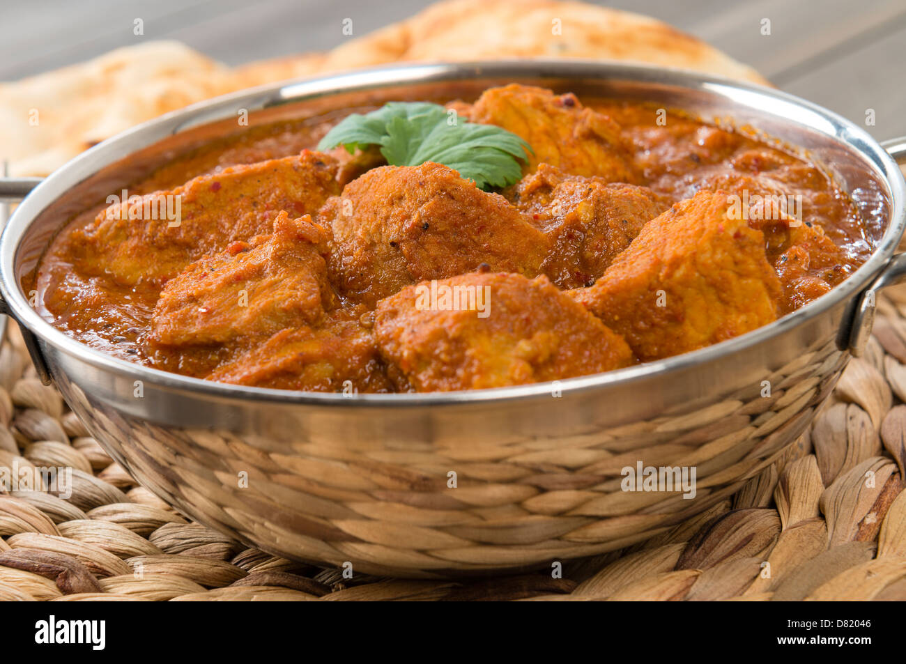 Goan Pork Vindaloo - Indian pork curry with naan bread. Traditional ...