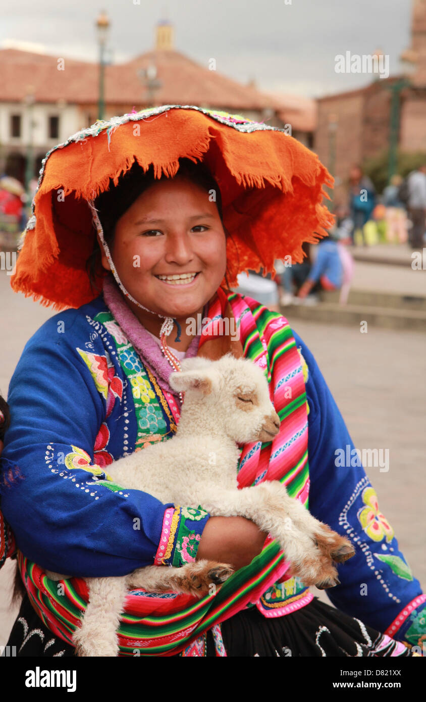 girl holding a baby lamb, Cuzco, Peru Stock Photo - Alamy