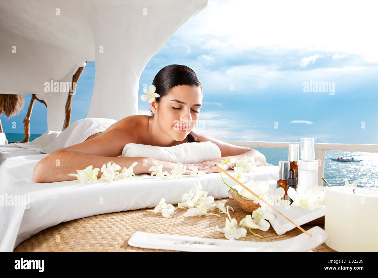 young woman lying on her front sptreatment Stock Photo - Alamy