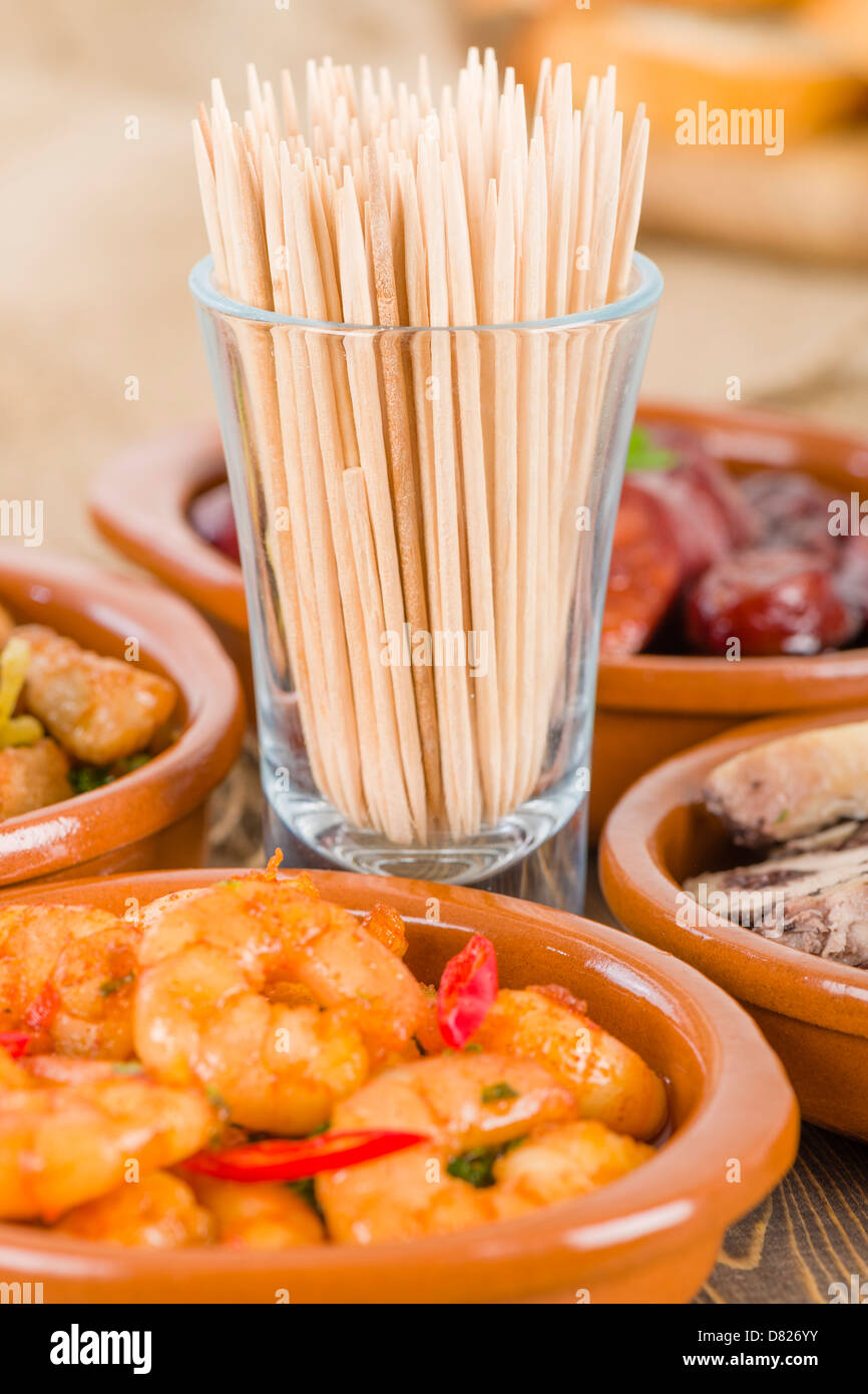 Tapas - Toothpicks surrounded by traditional Spanish tapas dishes Stock ...
