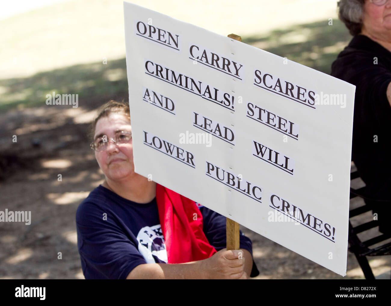 Gun rights advocates march around the Texas Capitol with signs asking ...