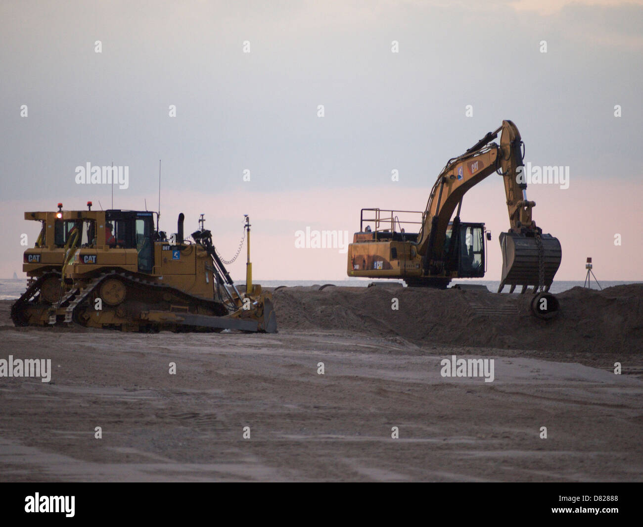 Caterpillar Digger and Dozer working on Mablethorpe beach, part of the ...