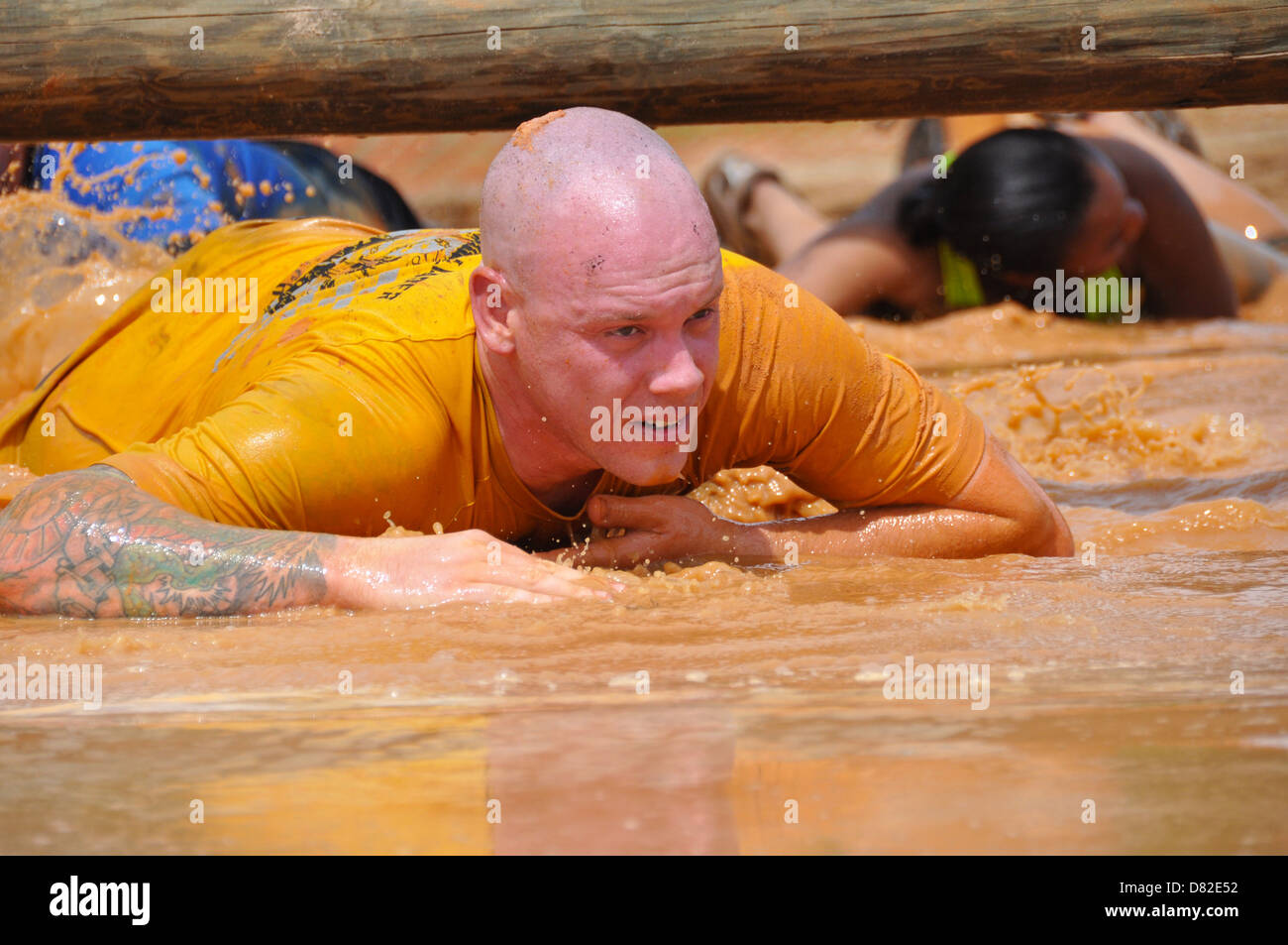 A sailor participates in the Marine Mud Challenge Stock Photo - Alamy