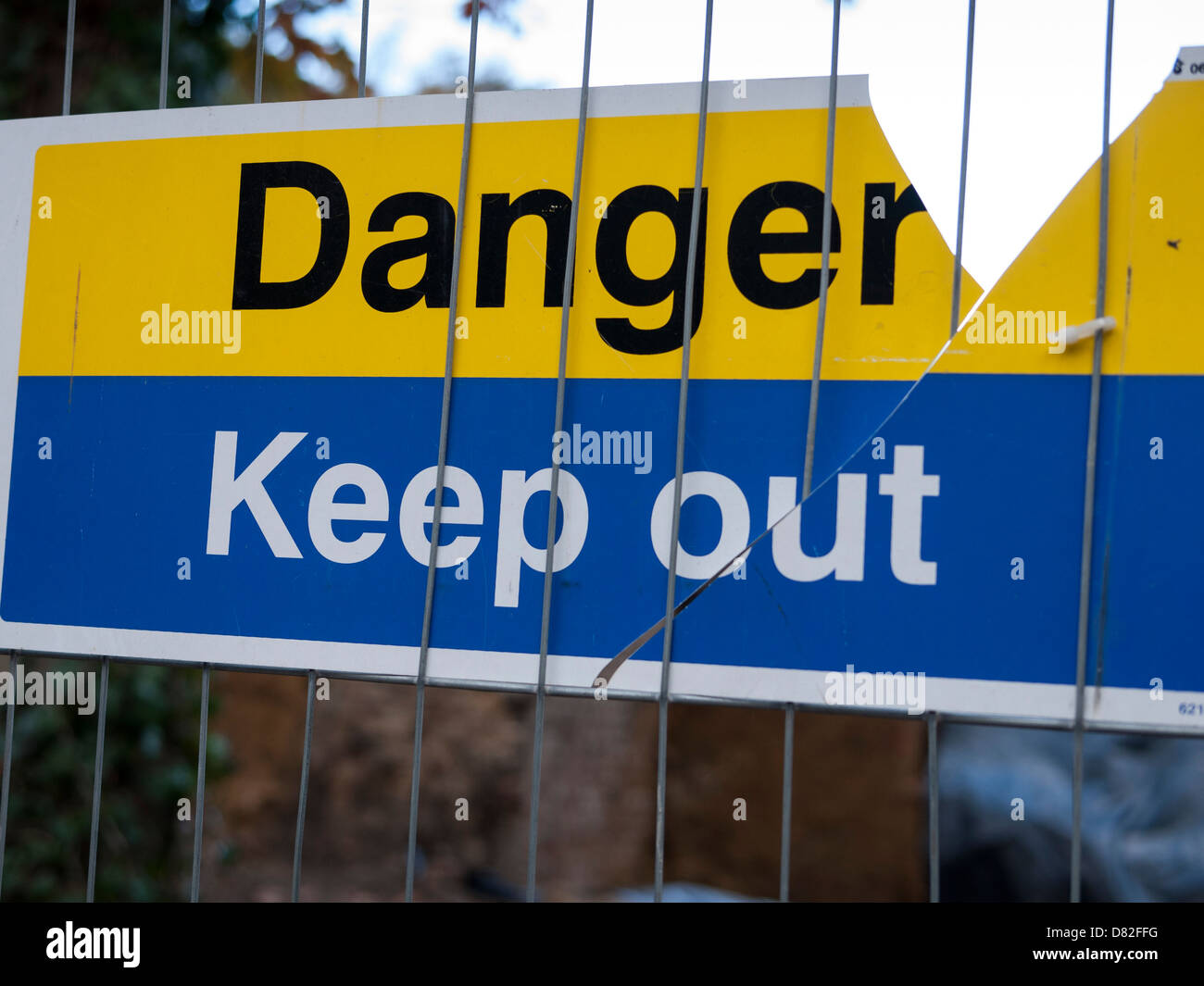 London, Yellow and blue Danger - Keep Out sign, close up photograph on ...