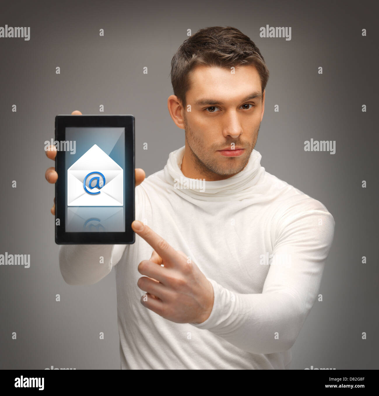 man pointing at tablet pc with email icon Stock Photo - Alamy