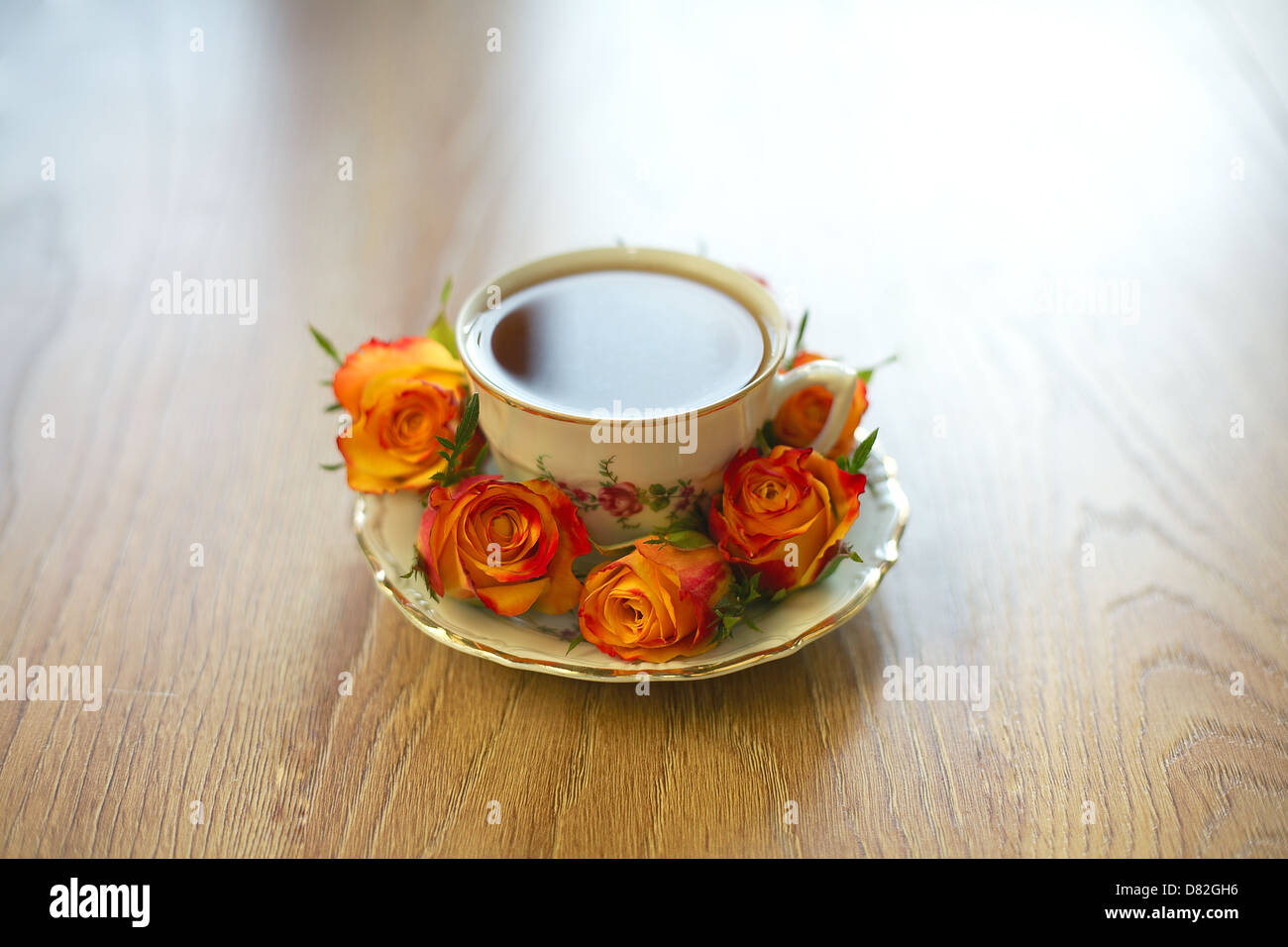 Porcelain tea cup with roses Stock Photo - Alamy