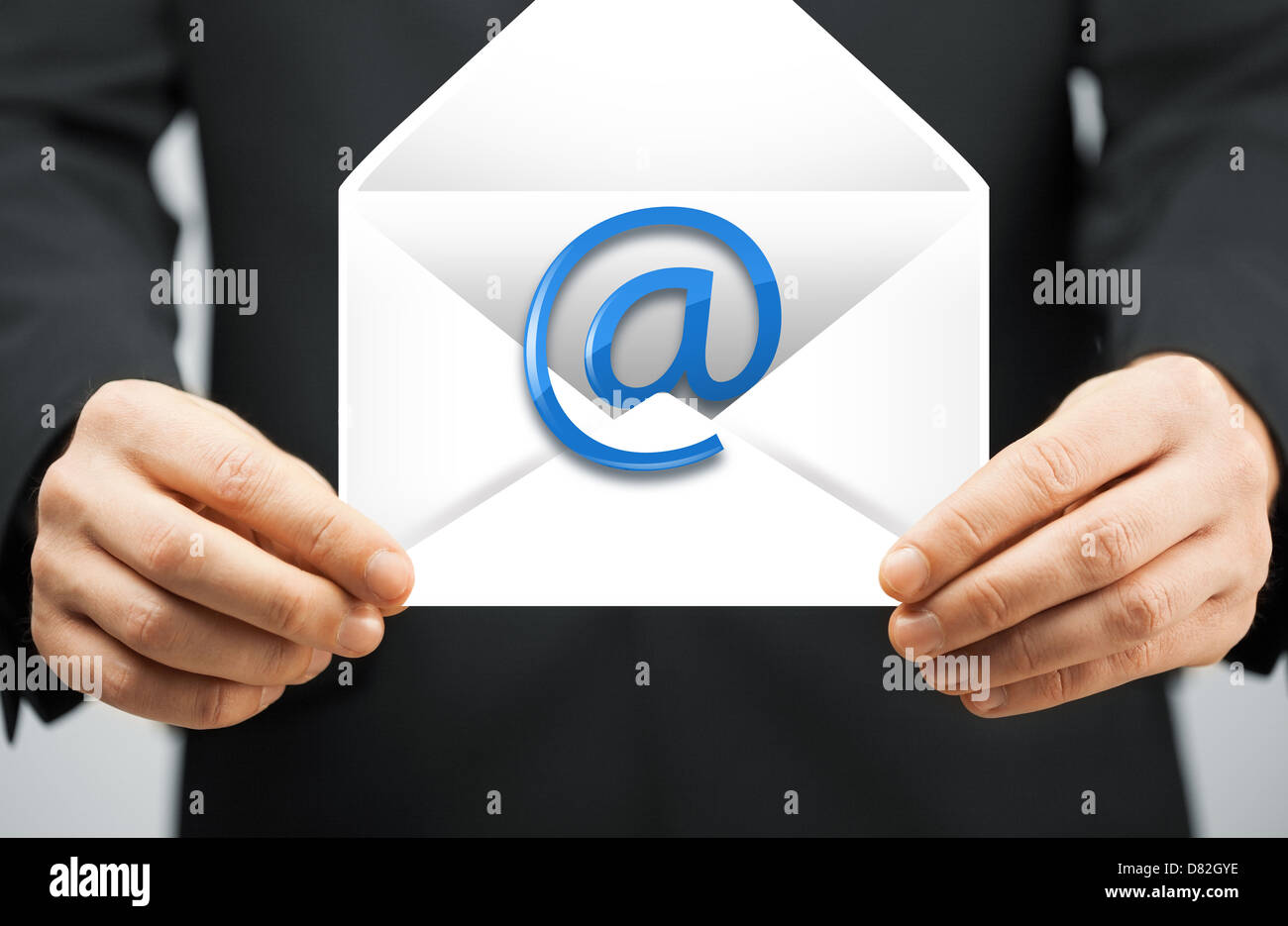 man in suit holding envelope with email sign Stock Photo - Alamy