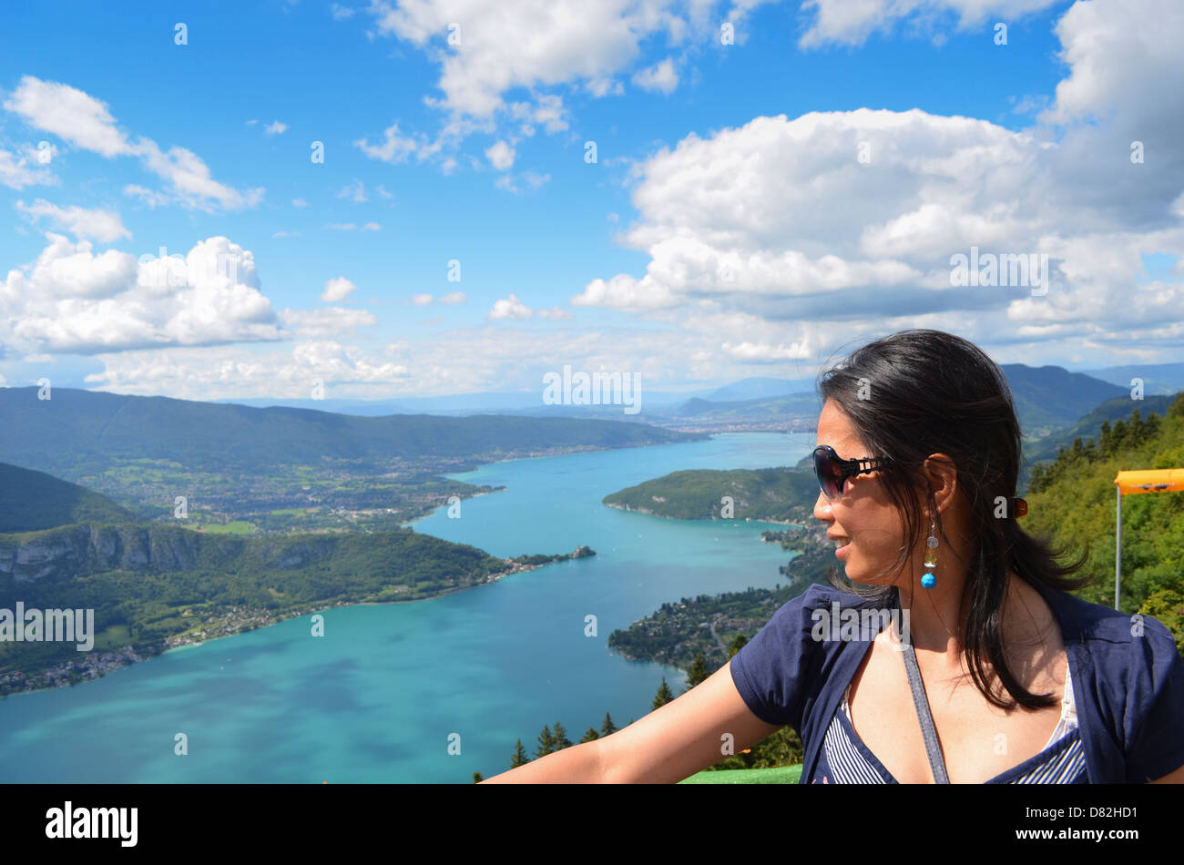 Girl looking over lake Stock Photo - Alamy