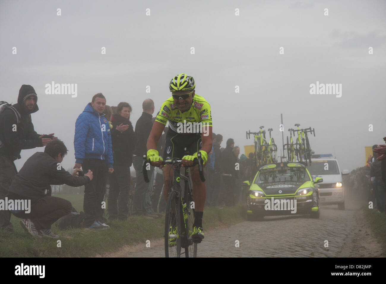 Professional riders followed by team cars at the Paris - Roubaix ...