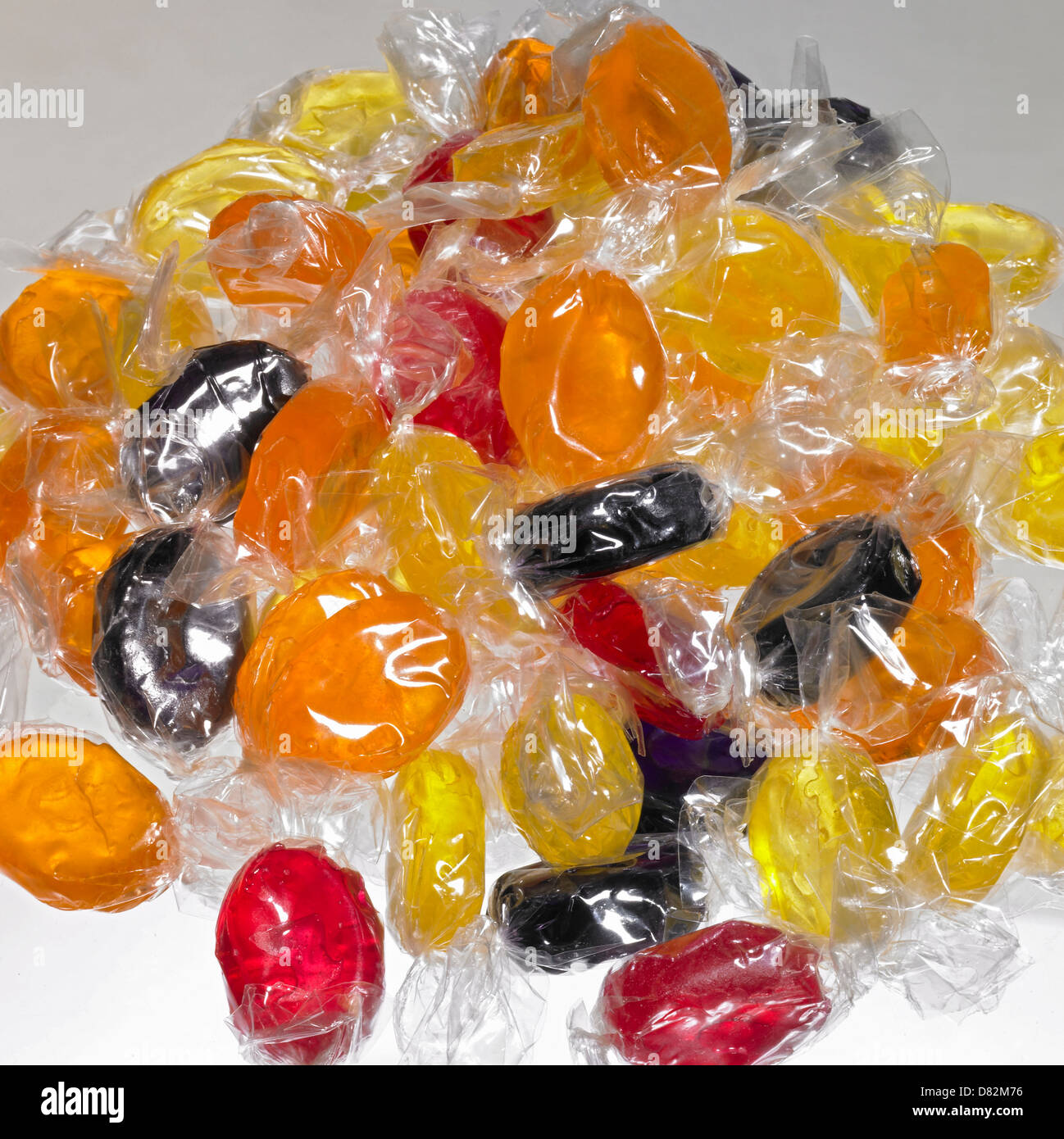 full frame background with wrapped colorful bonbons in light back Stock ...