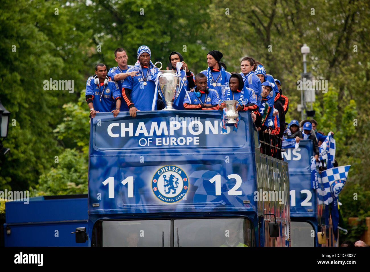 Chelsea Fans watch as the Chelsea footballers, celebrate on a bus in ...