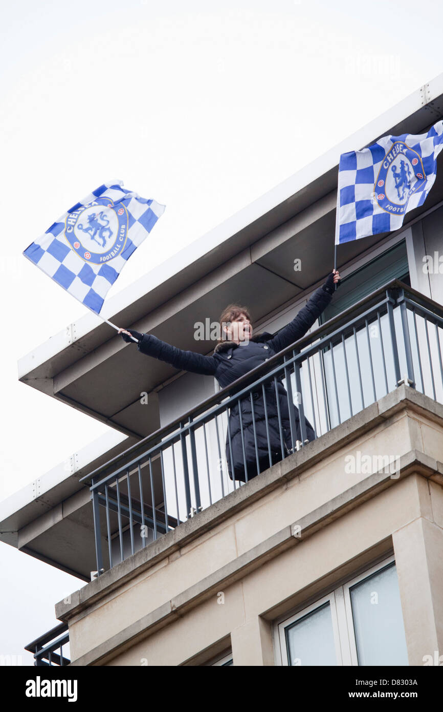 Chelsea Fans watch as the Chelsea footballers, celebrate on a bus in ...