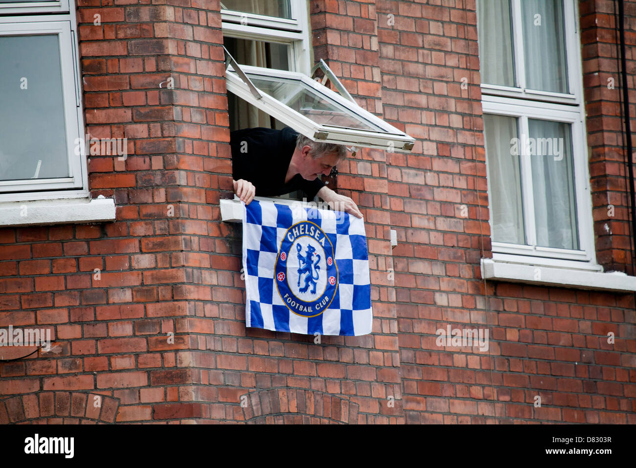Chelsea Fans watch as the Chelsea footballers, celebrate on a bus in ...