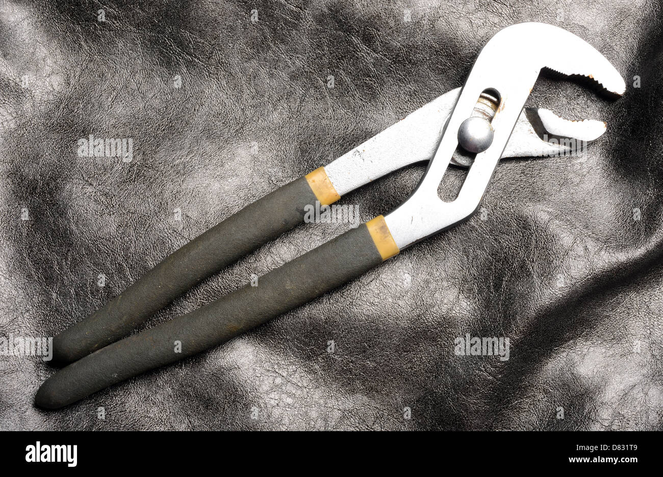 one pair of pliers on gray background Stock Photo - Alamy