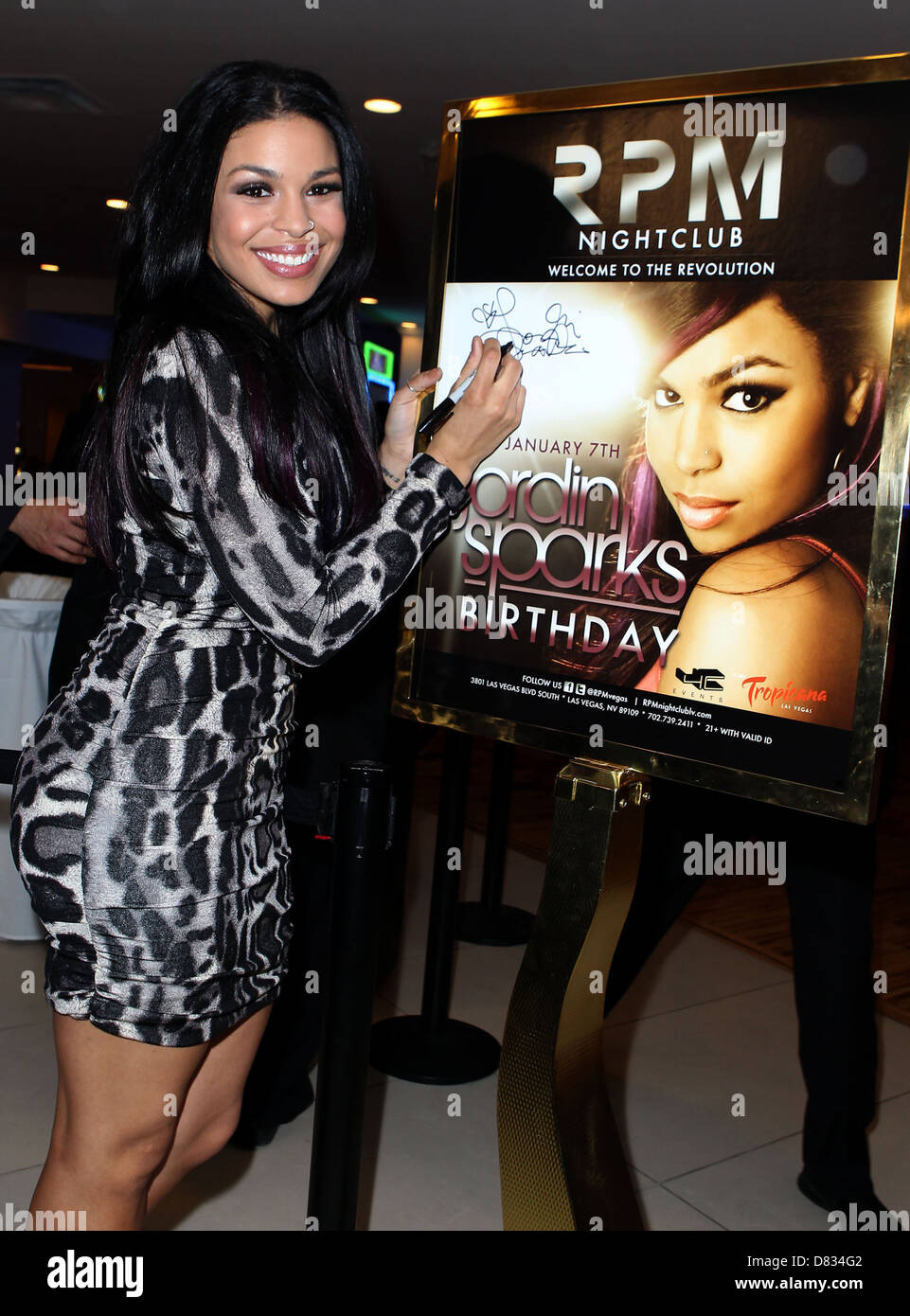Jordan Sparks Jordan Sparks, wearing Lisa Marie Fernandez, celebrates ...
