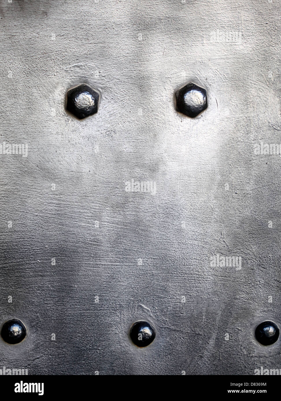 Black grunge metal plate or armour texture with rivets as background ...