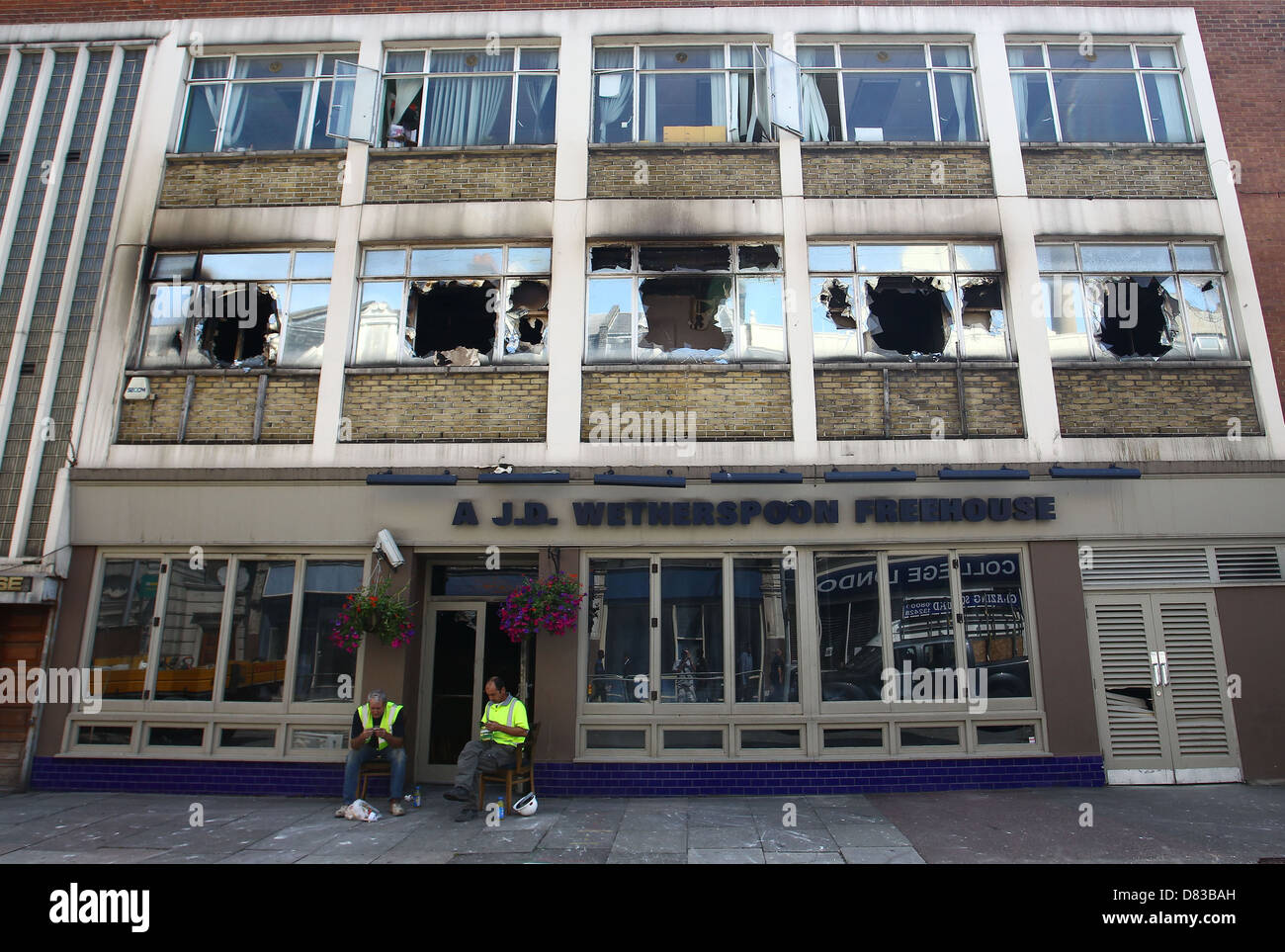 The aftermath of rioting in Woolwich, England on August 8, 2011 Police ...