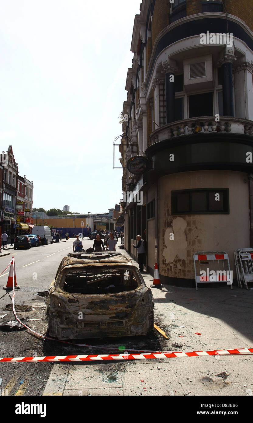 The aftermath of rioting in Woolwich, England on August 8, 2011 Police ...