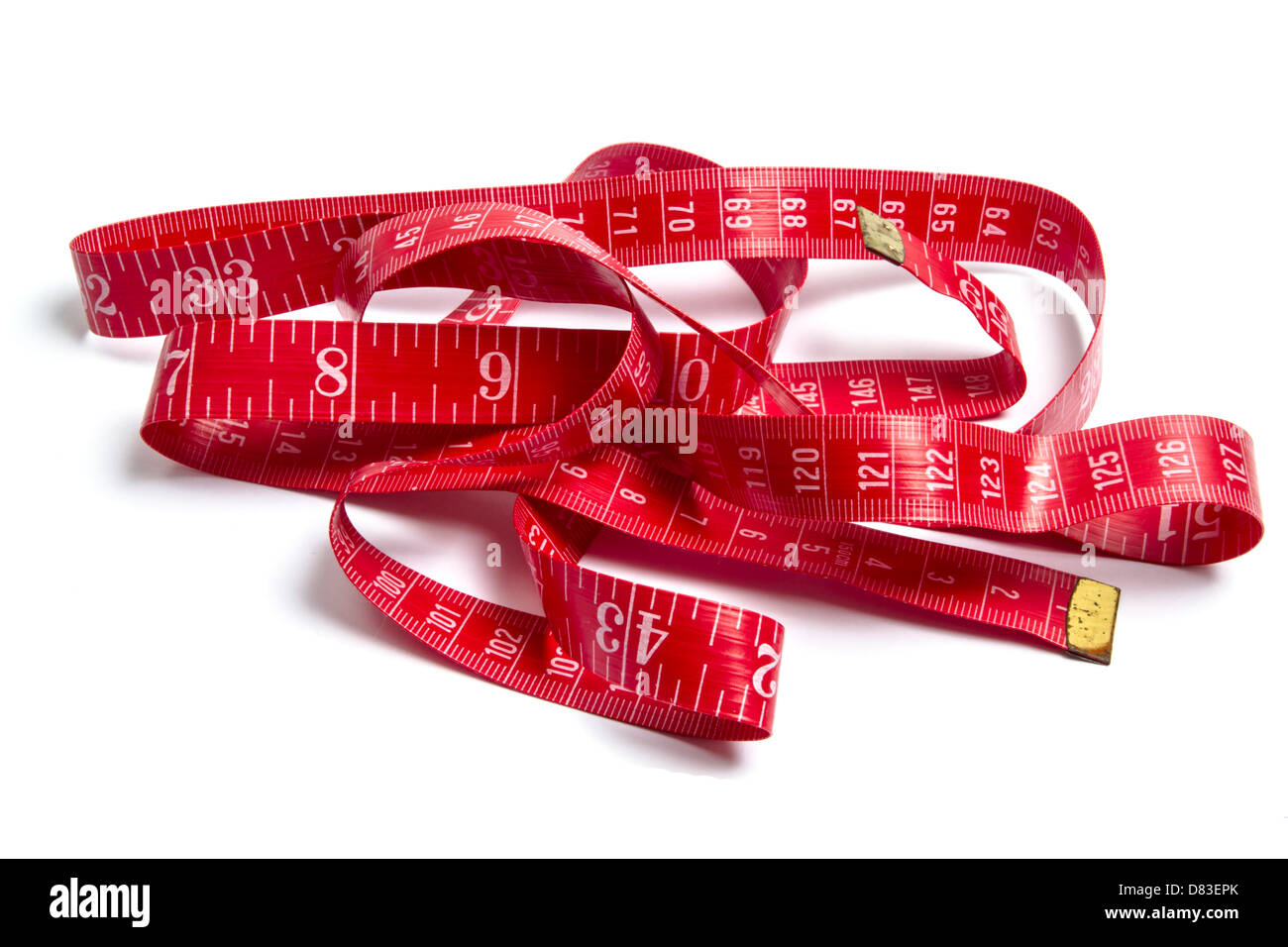 Red tape measure closeup on white background Stock Photo - Alamy