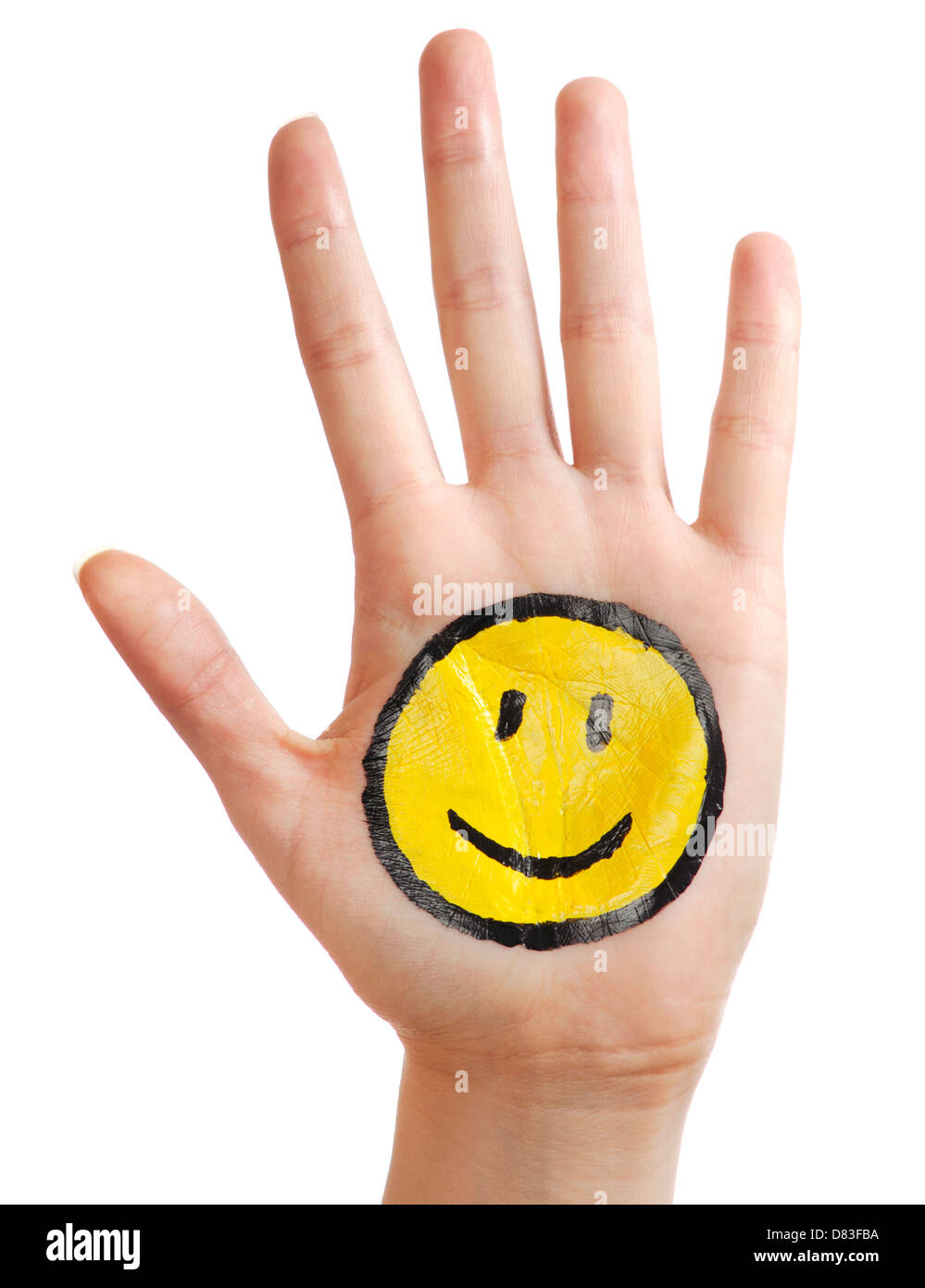 Open hand with a happy smiling smiley icon painted on it isolated on ...