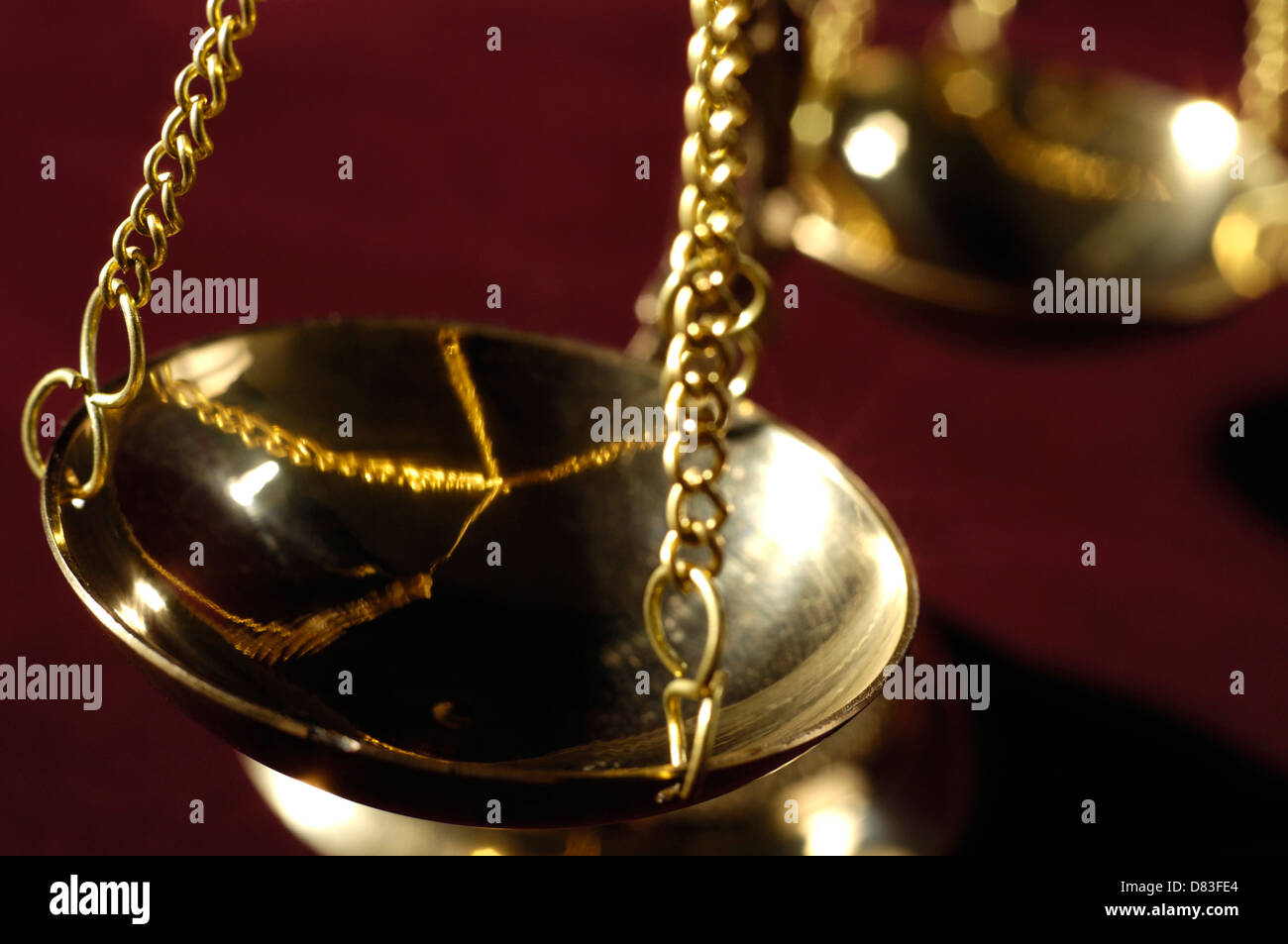 Closeup of empty justice scale pans isolated on dark red background ...