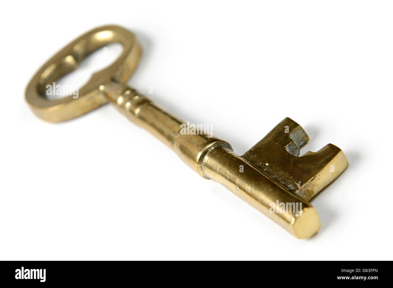 Antique brass key isolated on white background close-up Stock Photo - Alamy