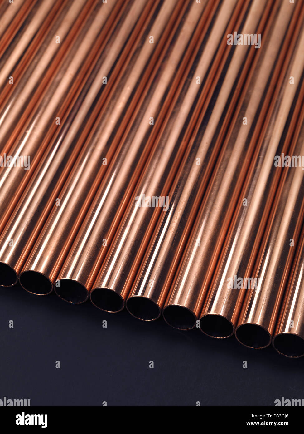 Shiny plumbing copper tubes abstract artistic background Stock Photo ...