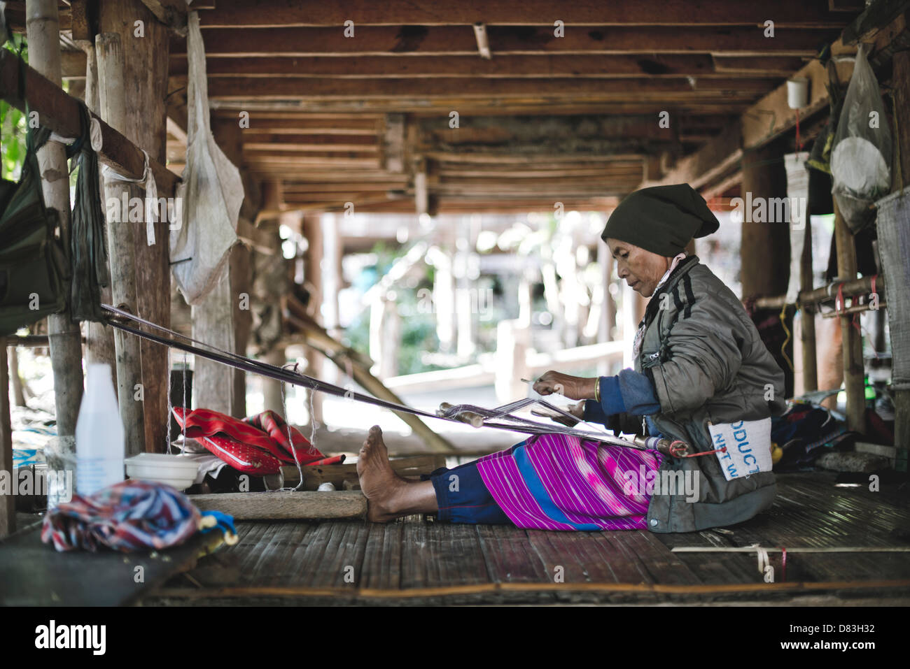 Woman weaving clothes Stock Photo - Alamy