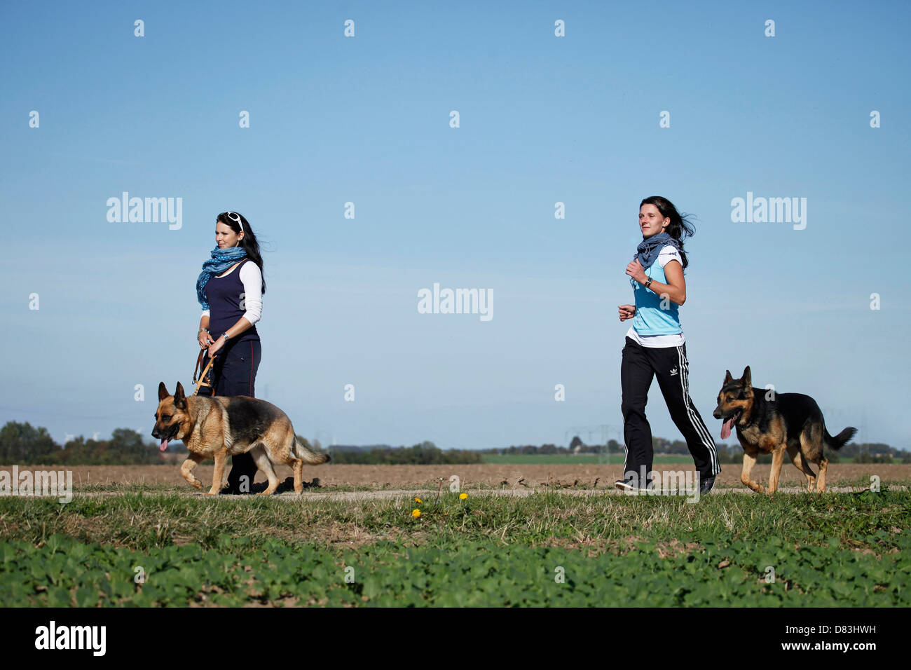 women with German Shepherd Stock Photo - Alamy