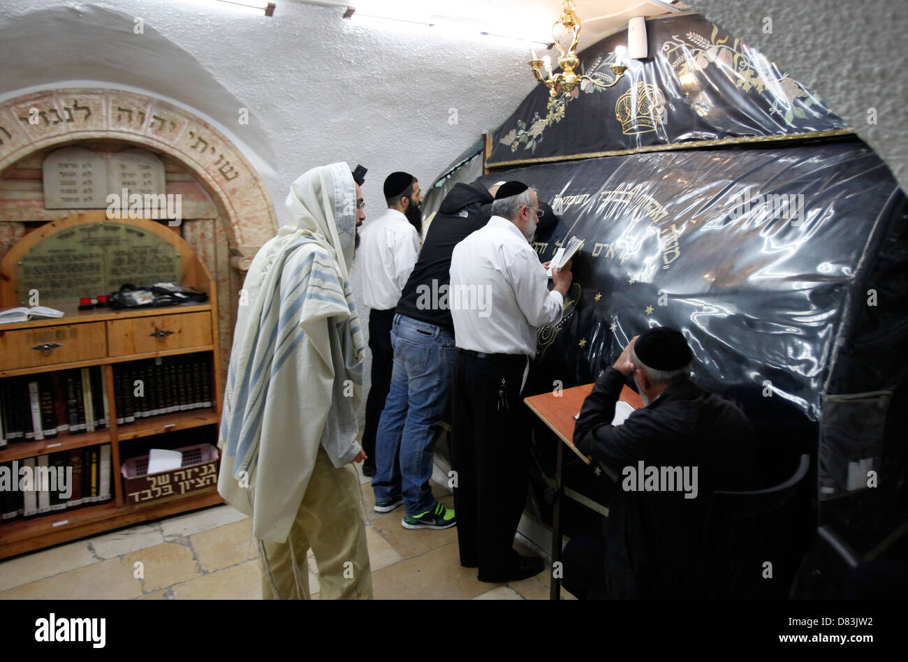 Religious Jews pray at the underground chamber synagogue underneath ...