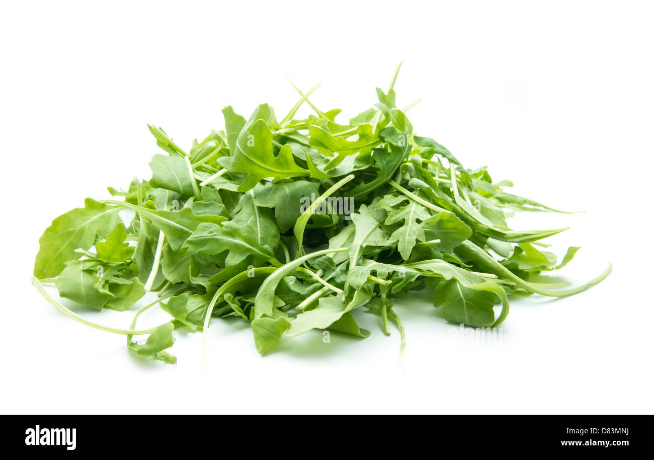 heap of rucola leaves isolated on white background Stock Photo - Alamy