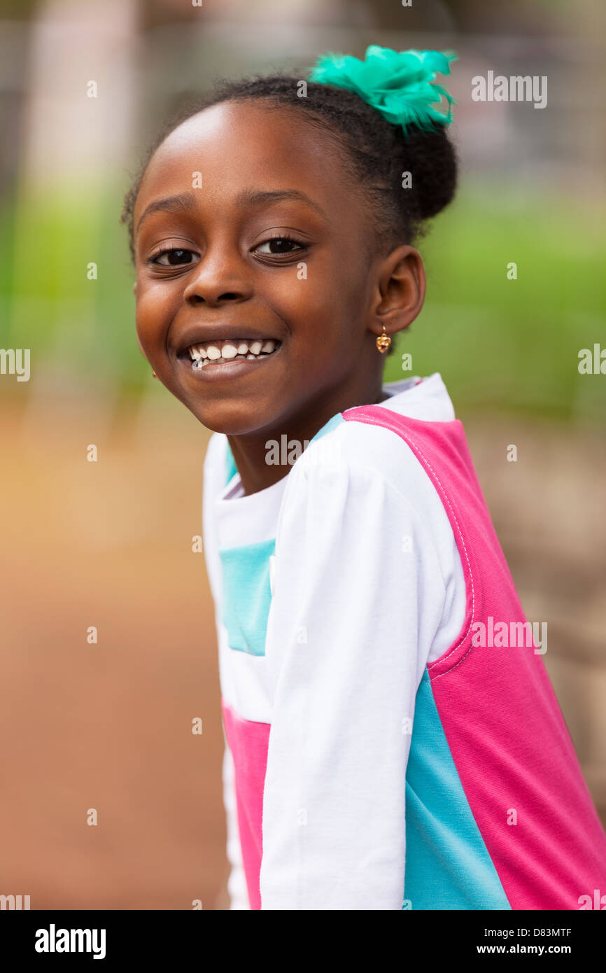 Outdoor Close Up Portrait Of A Cute Young Black Girl Smiling African