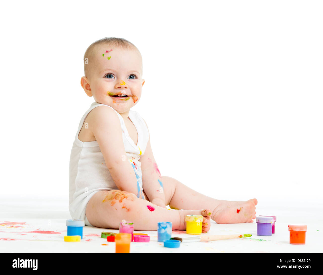 smiling baby drawing with a finger's paints Stock Photo - Alamy
