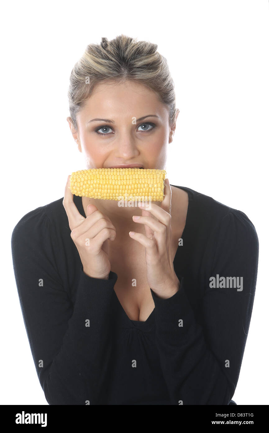 Young Woman Eating A Freshly Cooked Healthy Vegetarian Corn on the Cob ...