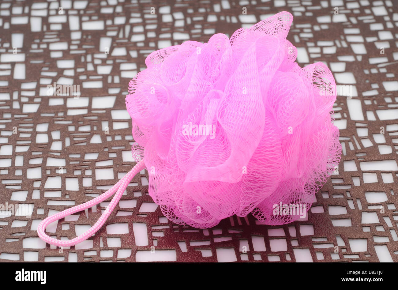 Hot pink loofah for a bath and body product Stock Photo - Alamy