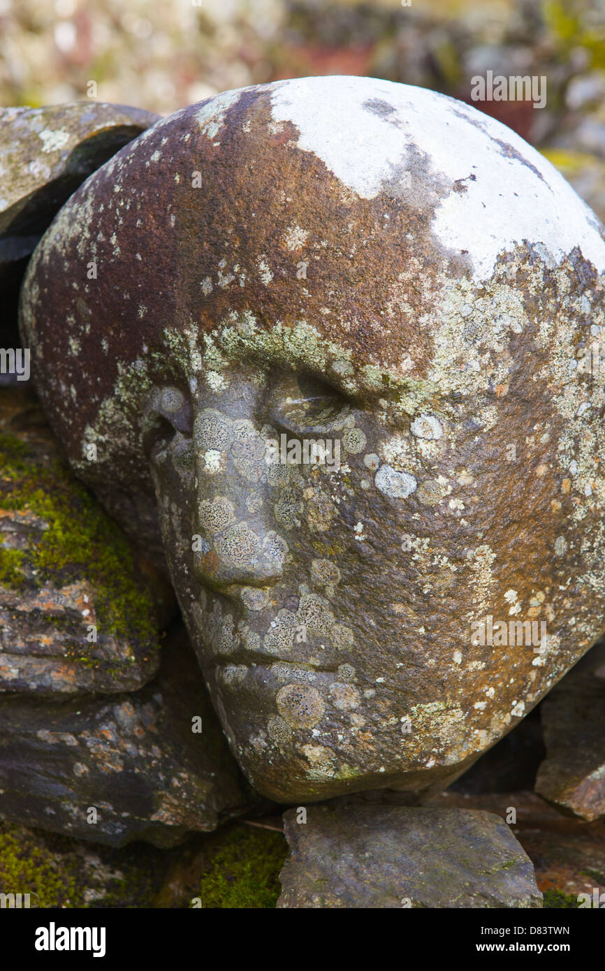 Stone sculpted human faces embedded in a dry stone dyke by Matt Baker ...