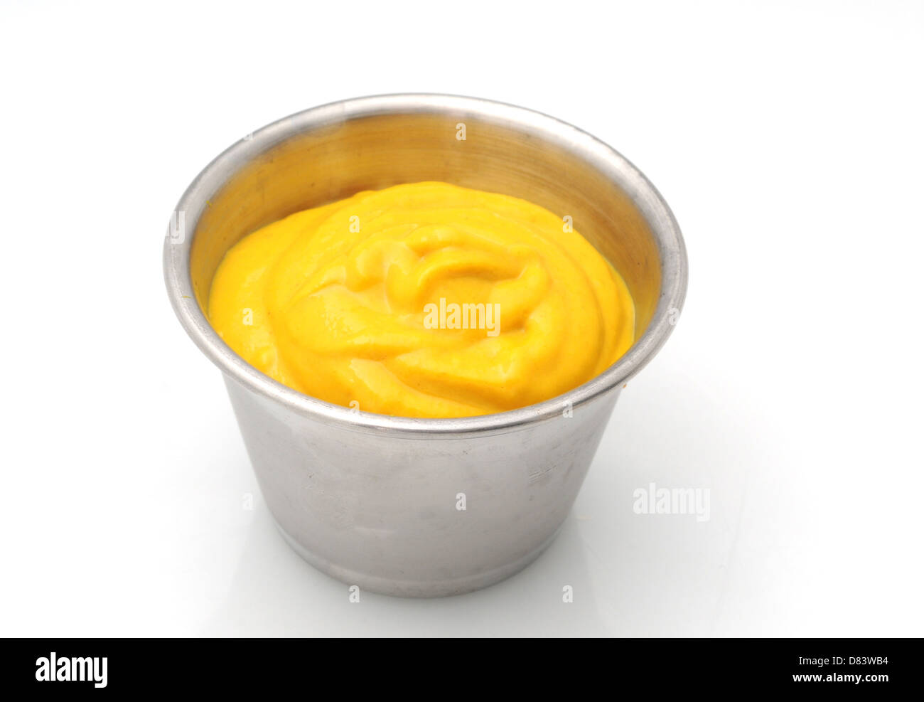 Yellow mustard condiment in a metal container Stock Photo - Alamy