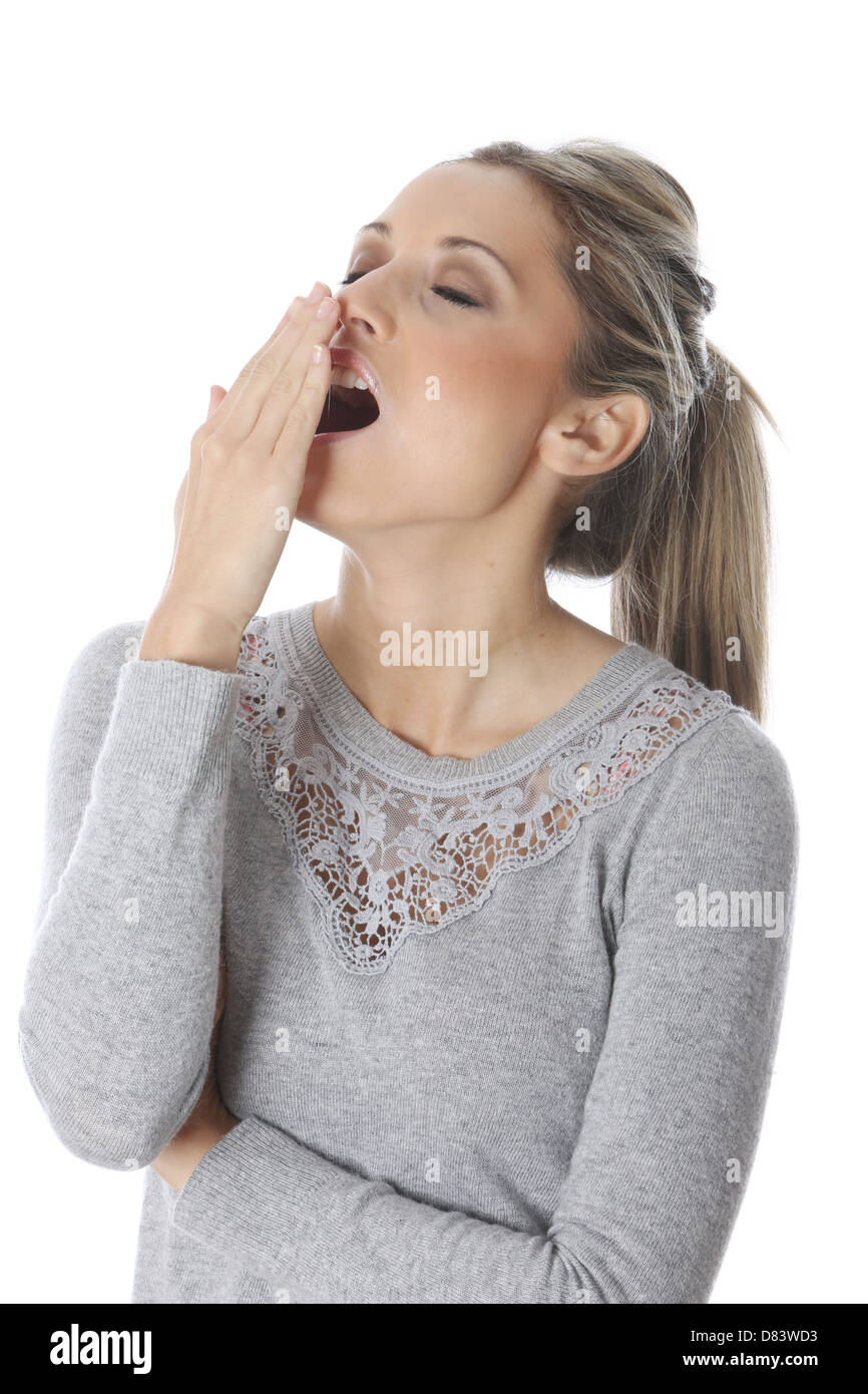 Yawning woman covering mouth hand hi-res stock photography and images ...