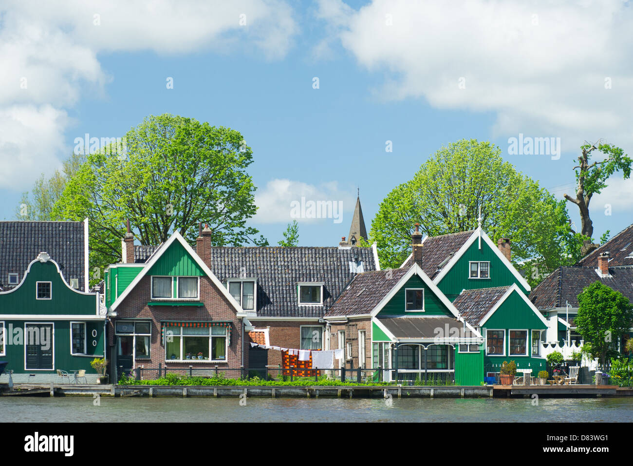 Row green wooden houses in typical Dutch village Stock Photo - Alamy