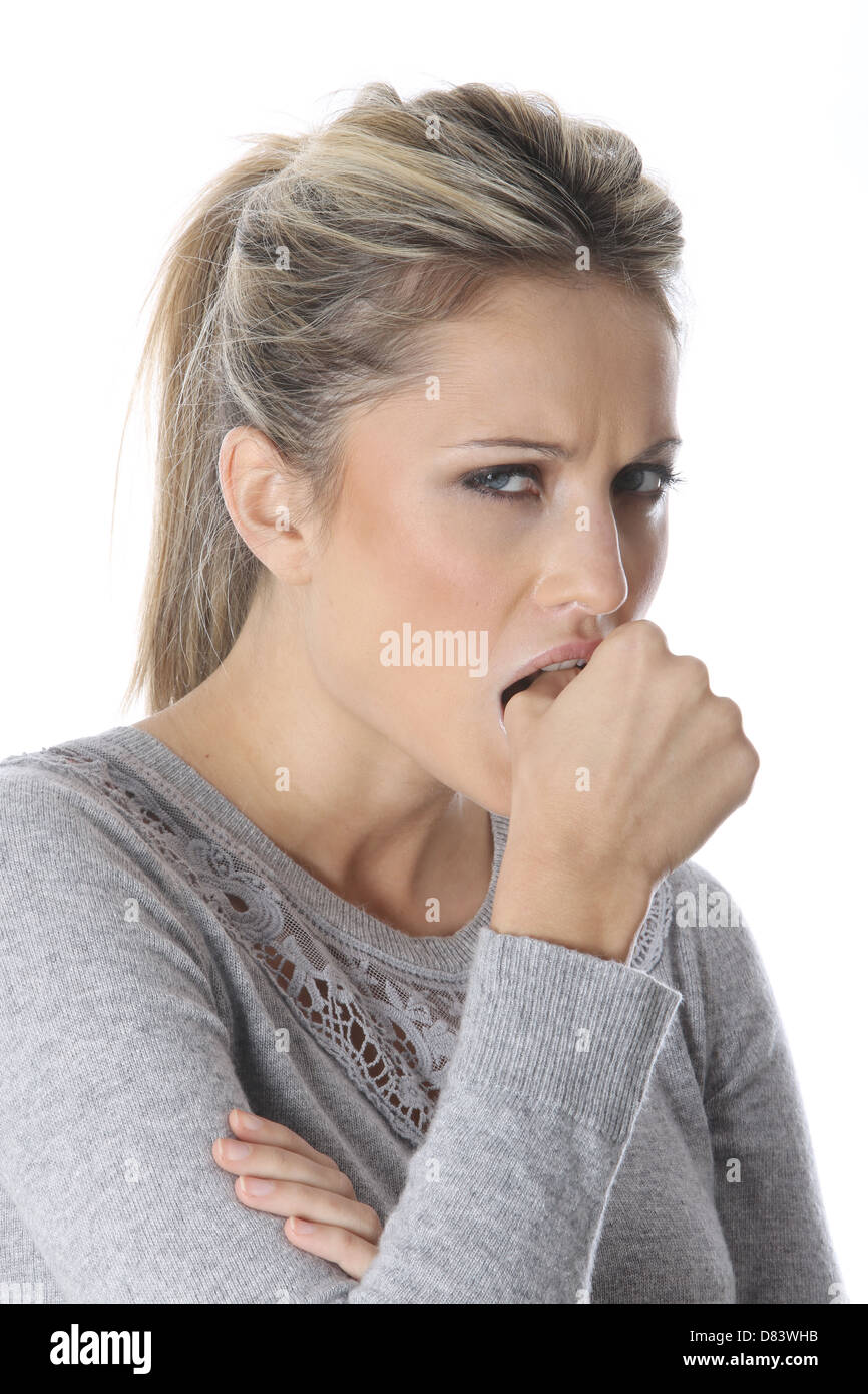 Model Released. Young Woman Biting Thumb Stock Photo - Alamy