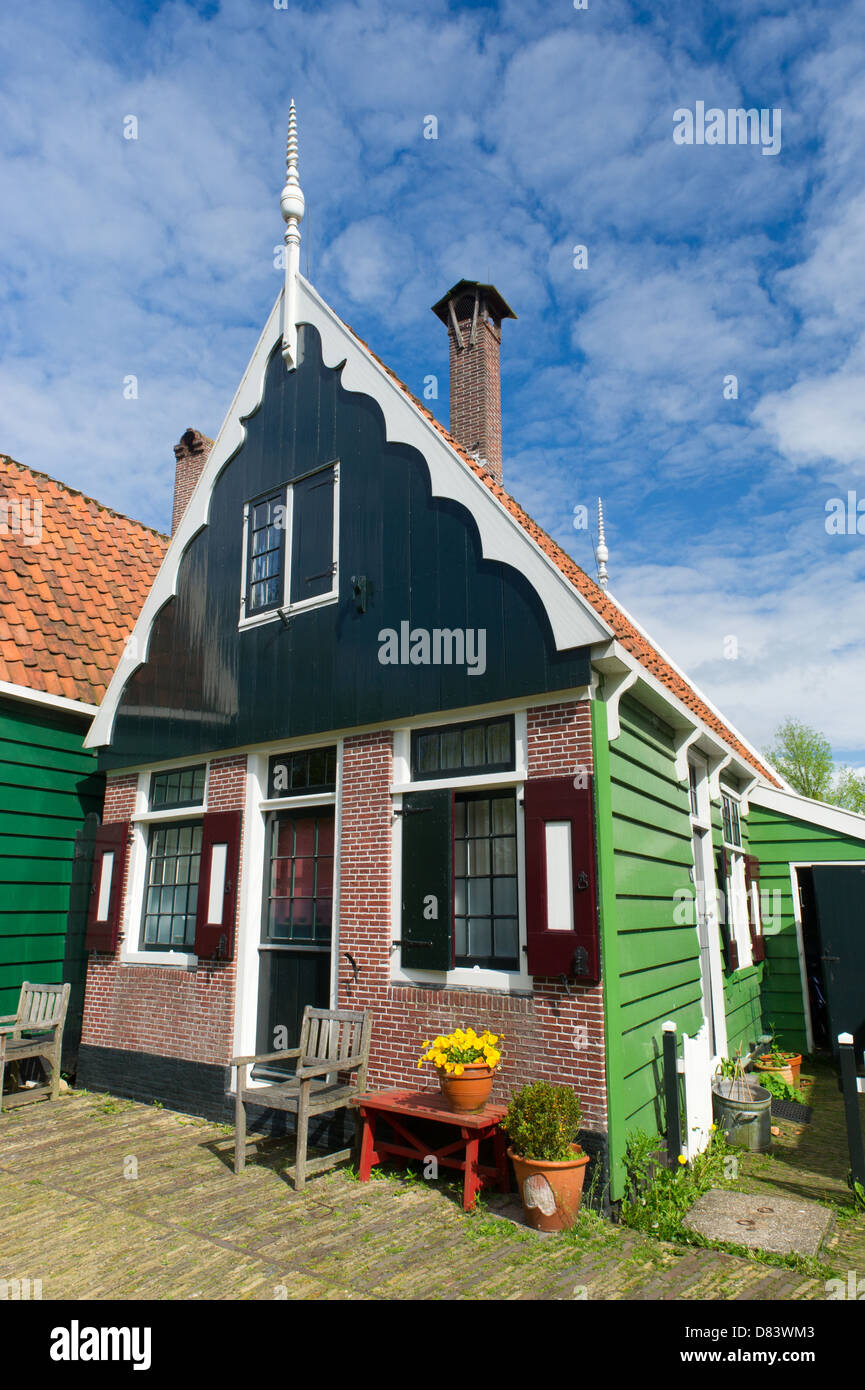 Typical Dutch village with green wooden houses and ditch Stock Photo ...
