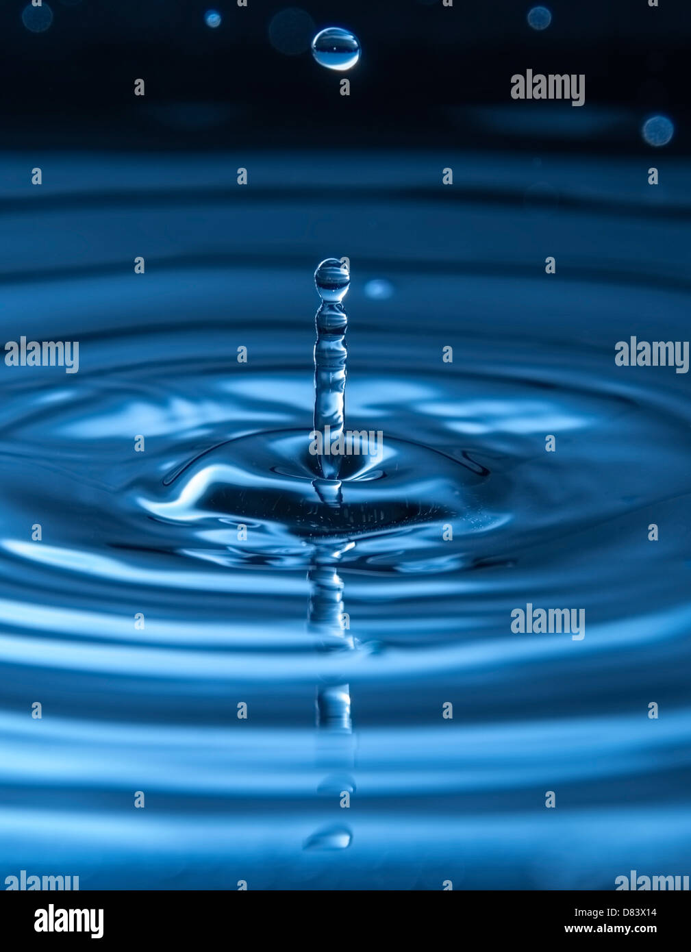 Water drop splash in blue Stock Photo - Alamy