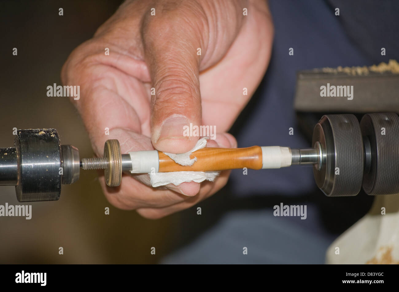 applying friction polish to pen blank Stock Photo - Alamy