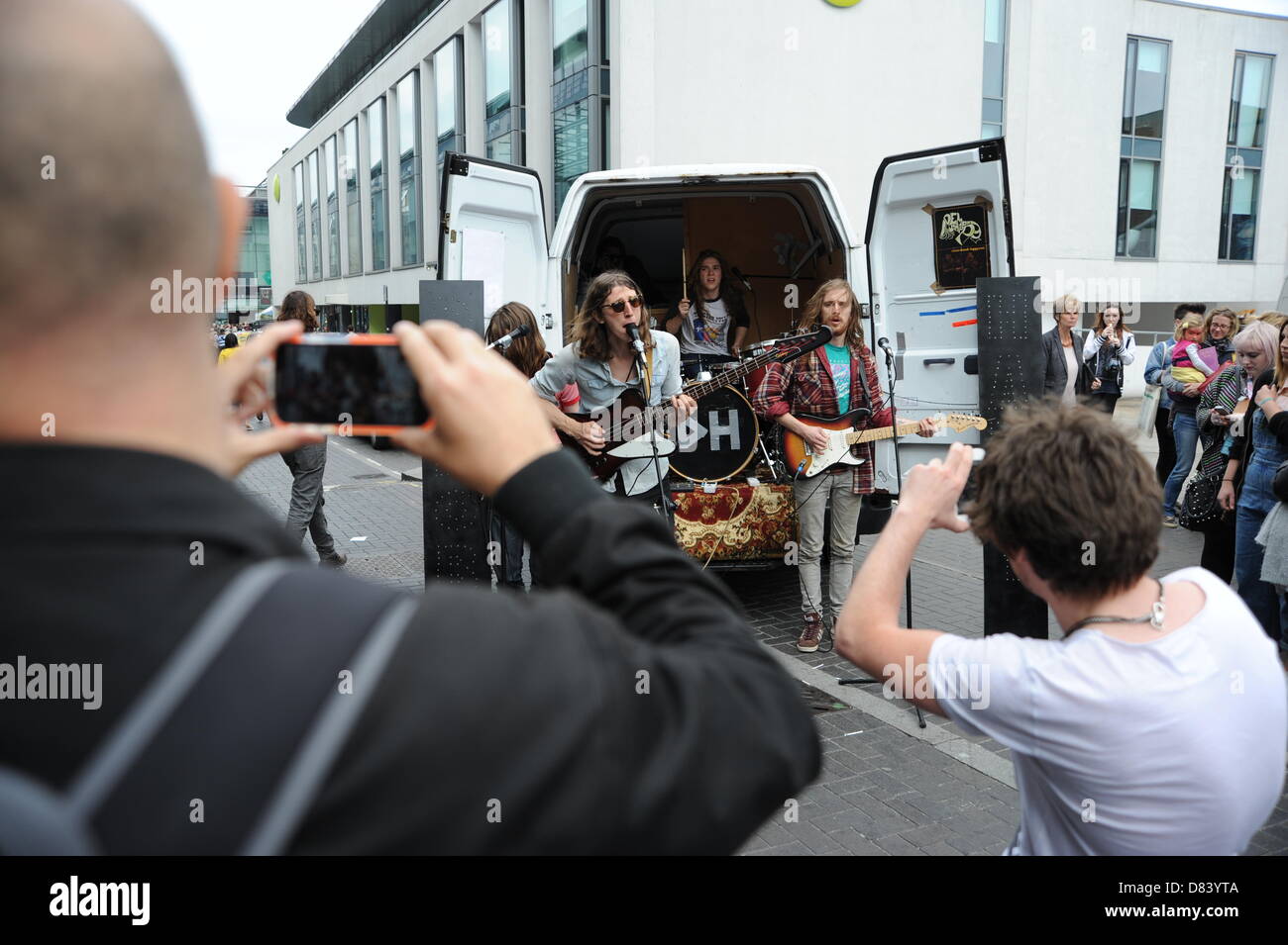 The rock band Demob Happy play to a crowd out of the back of their van ...