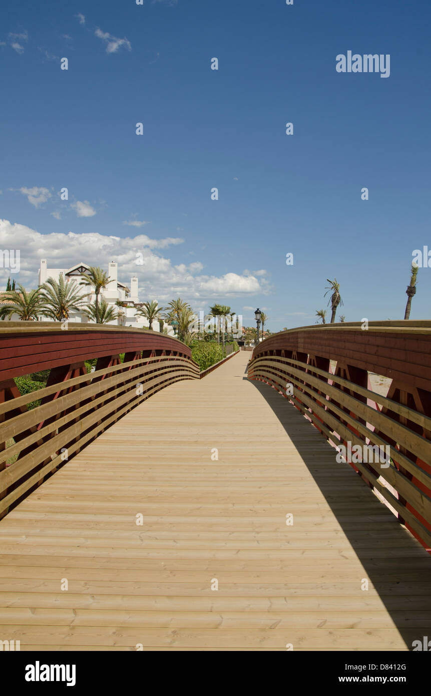 Wooden bridge over river at playa del pinillo, luxury beach properties ...
