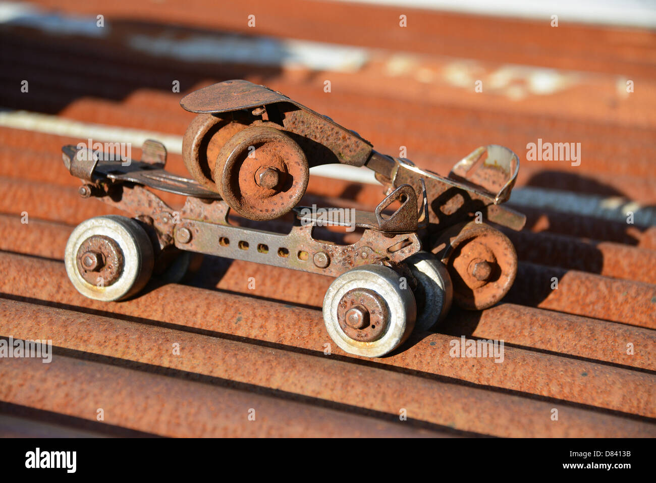 Rusty vintage roller skates on a rusty tin roof Stock Photo - Alamy