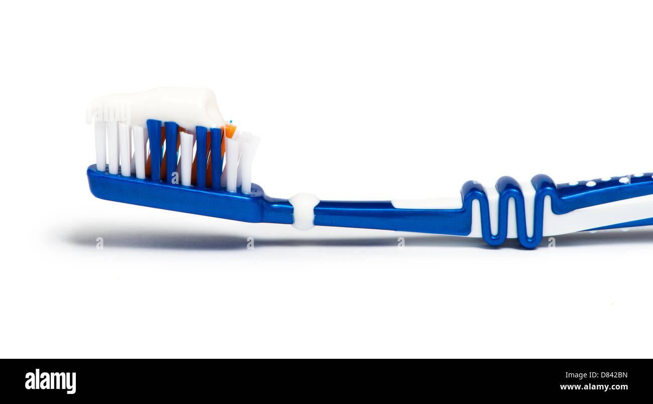 Blue toothbrush toothpaste white isolated studio shot Stock Photo - Alamy