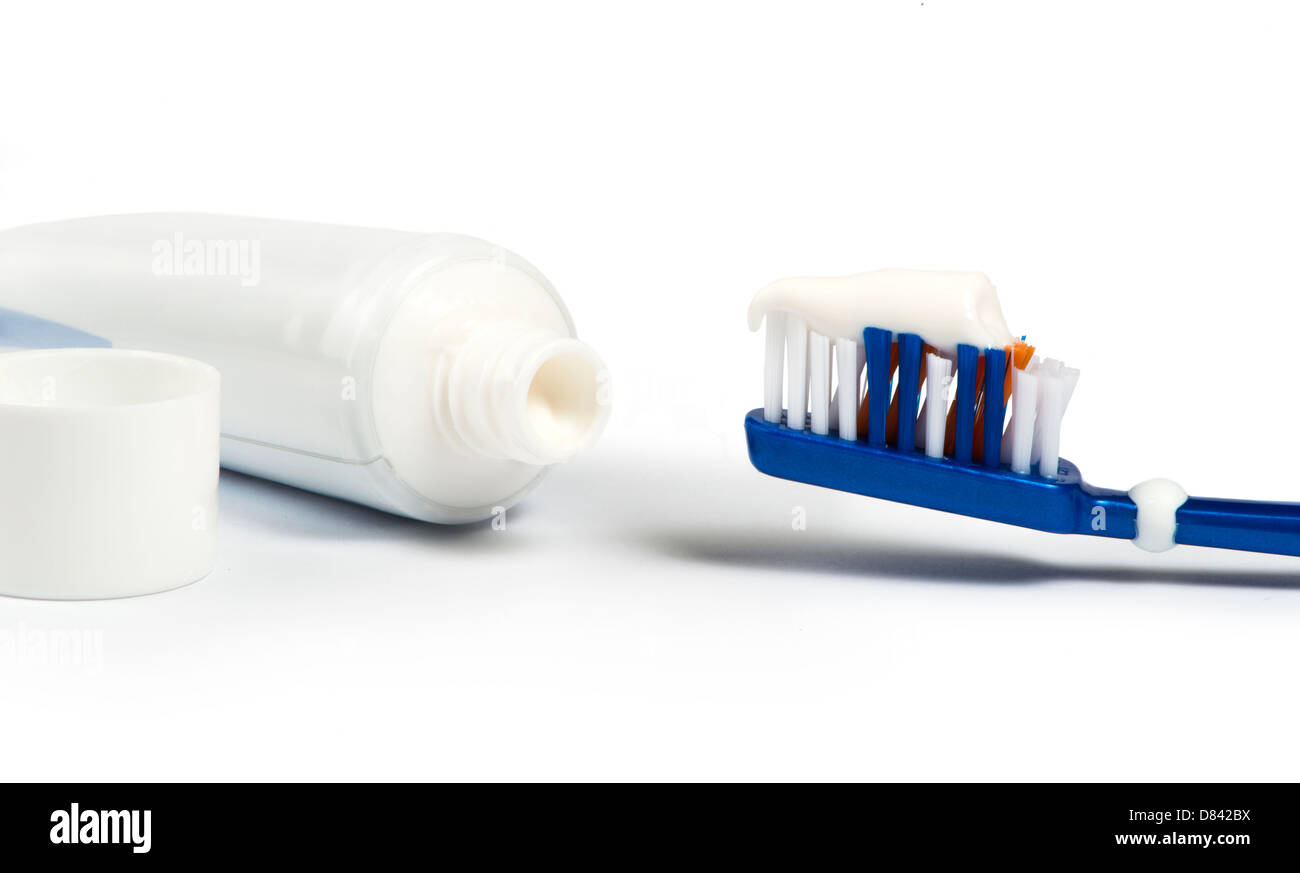 Blue toothbrush toothpaste white isolated studio shot Stock Photo - Alamy