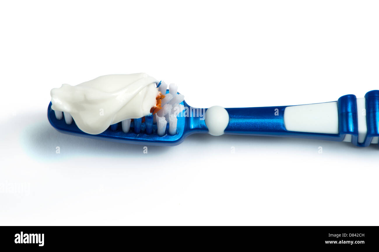 Blue toothbrush toothpaste white isolated studio shot Stock Photo - Alamy