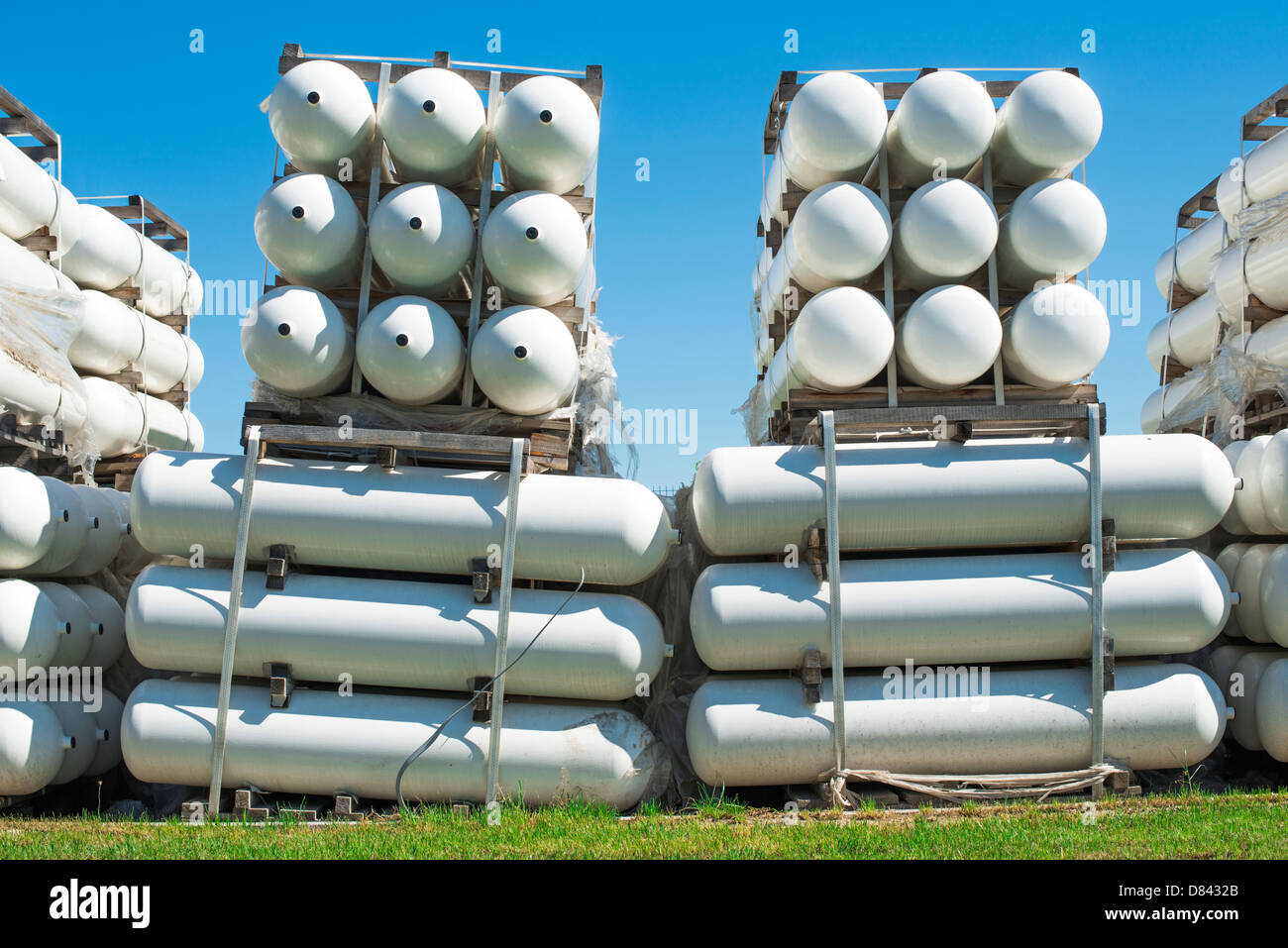 White industrial butan bottles.Compressed natural gas Stock Photo - Alamy